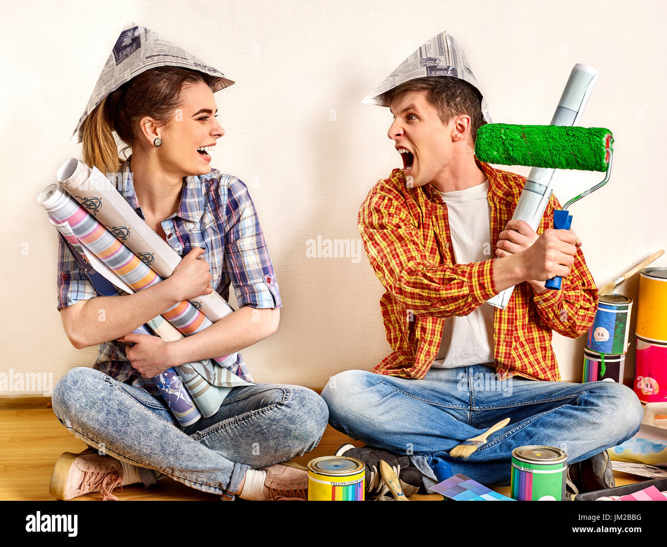 Repair family by happy couple building home . Quarrel family Stock ...