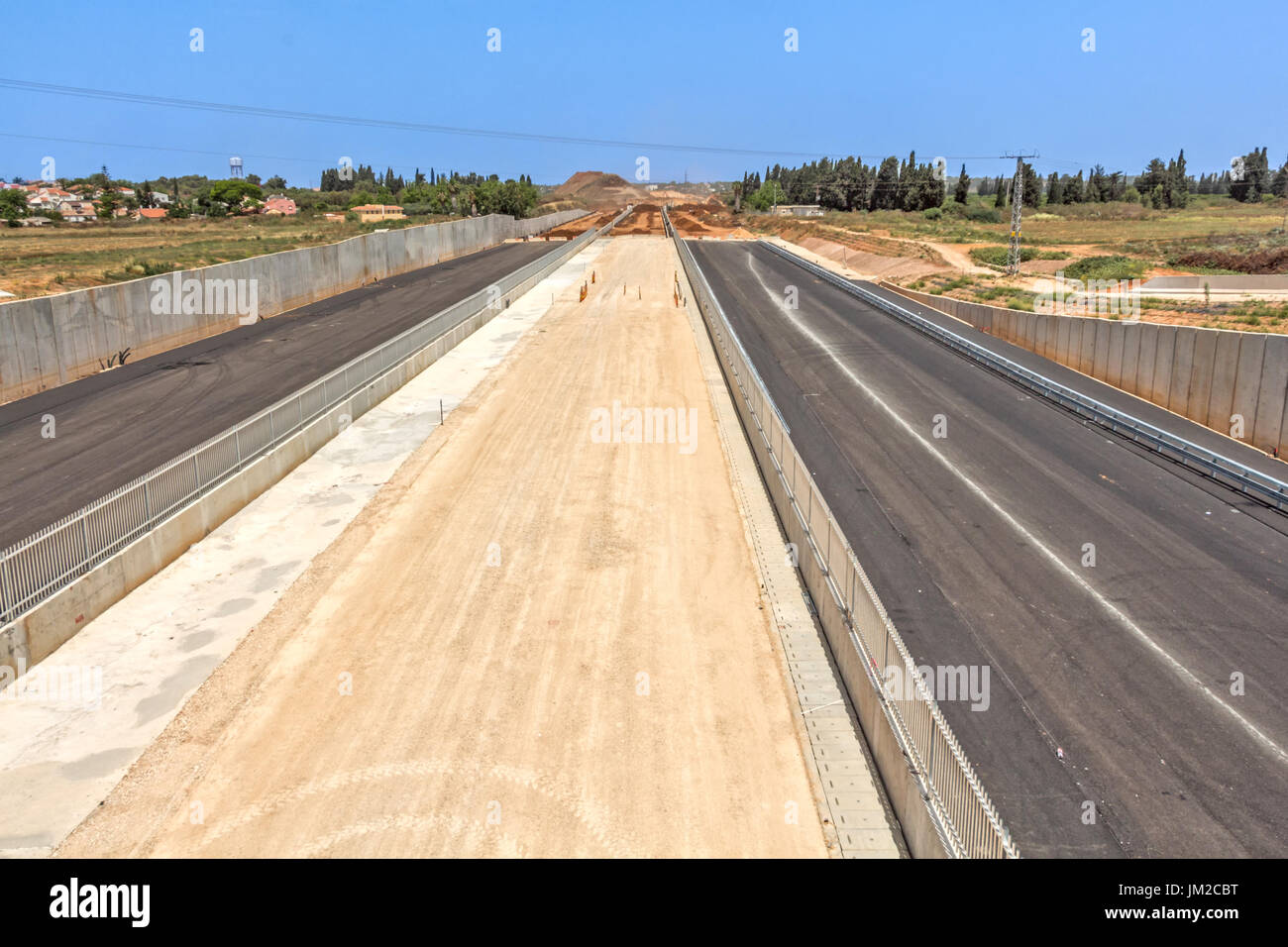 Paving a new road Stock Photo - Alamy