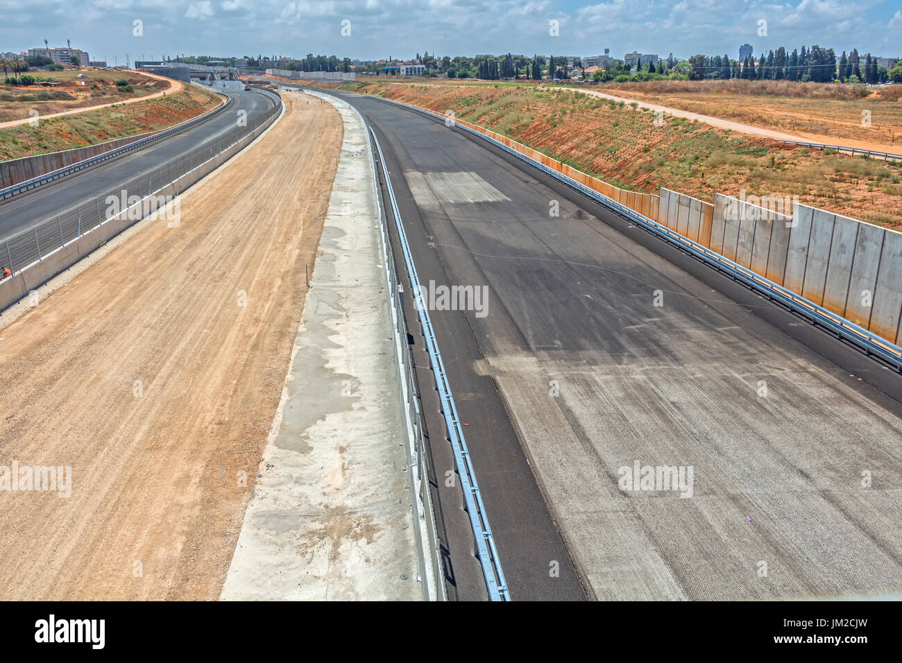 Paving a new road Stock Photo - Alamy