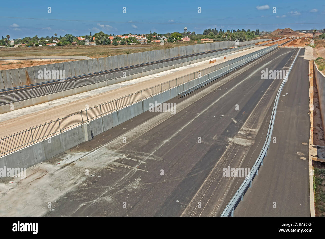 Paving a new road Stock Photo - Alamy