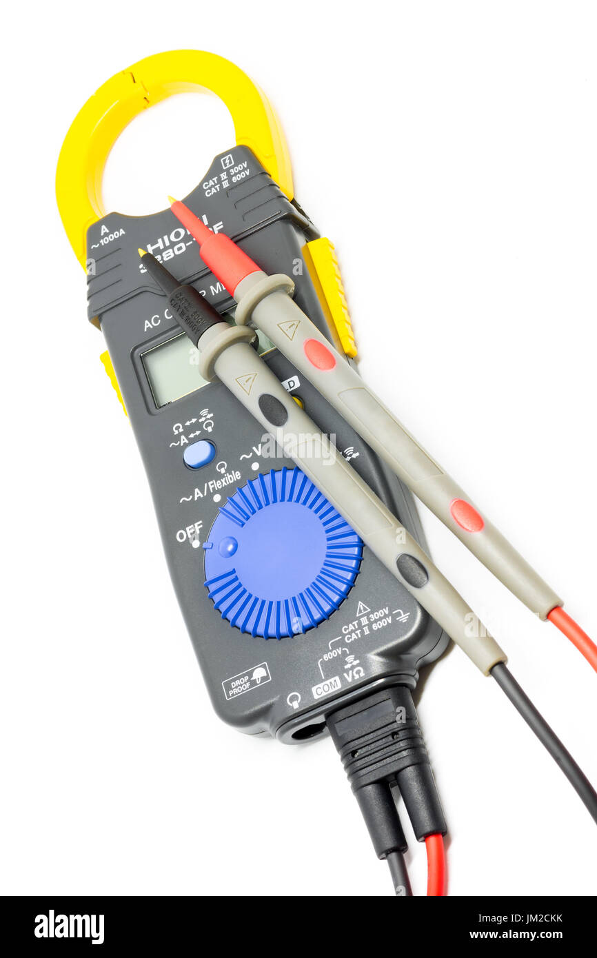 Electric digital multimeter. Clamp digital meter on the white ...