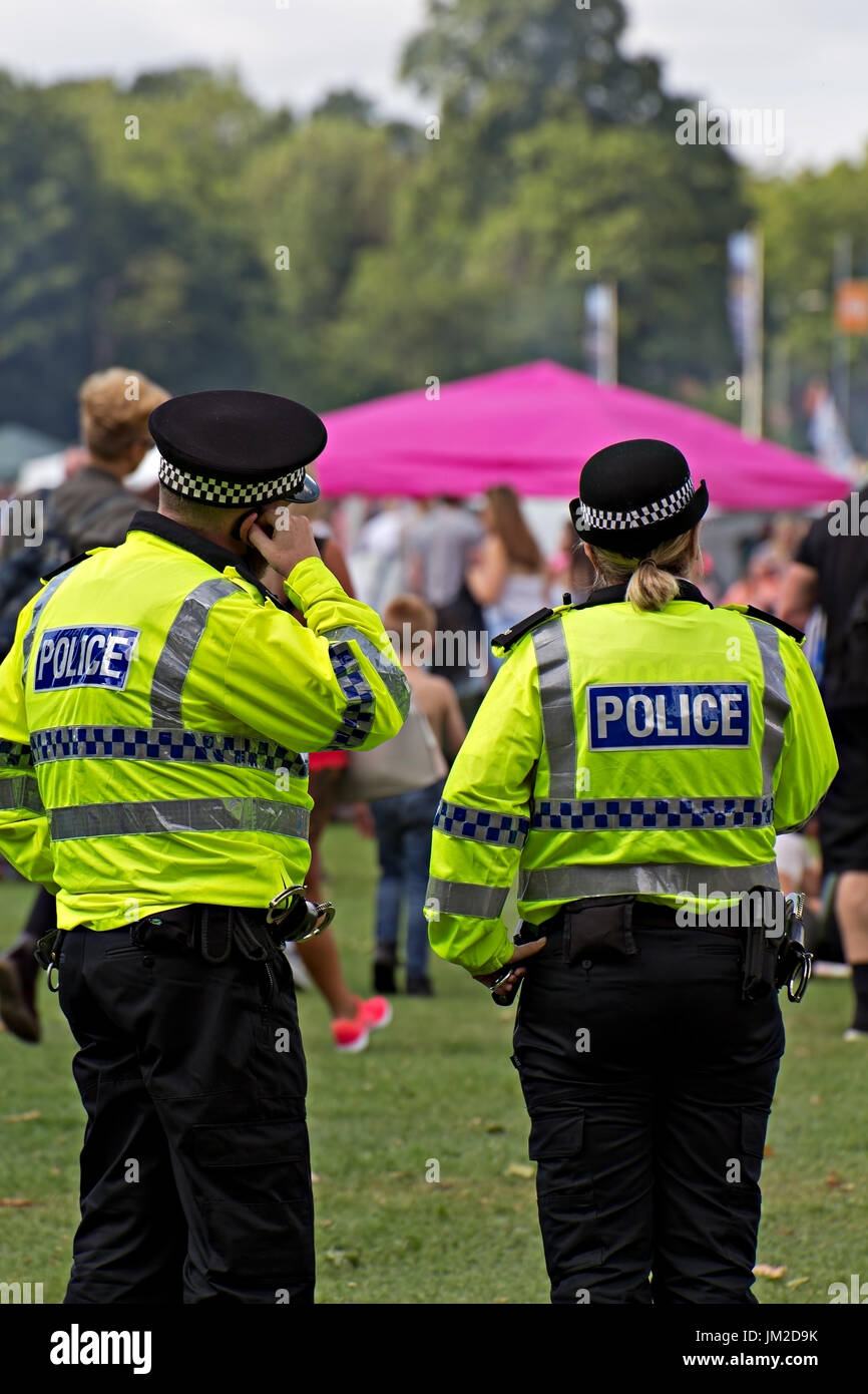 British police officers on duty at an outdoor music festival Stock ...