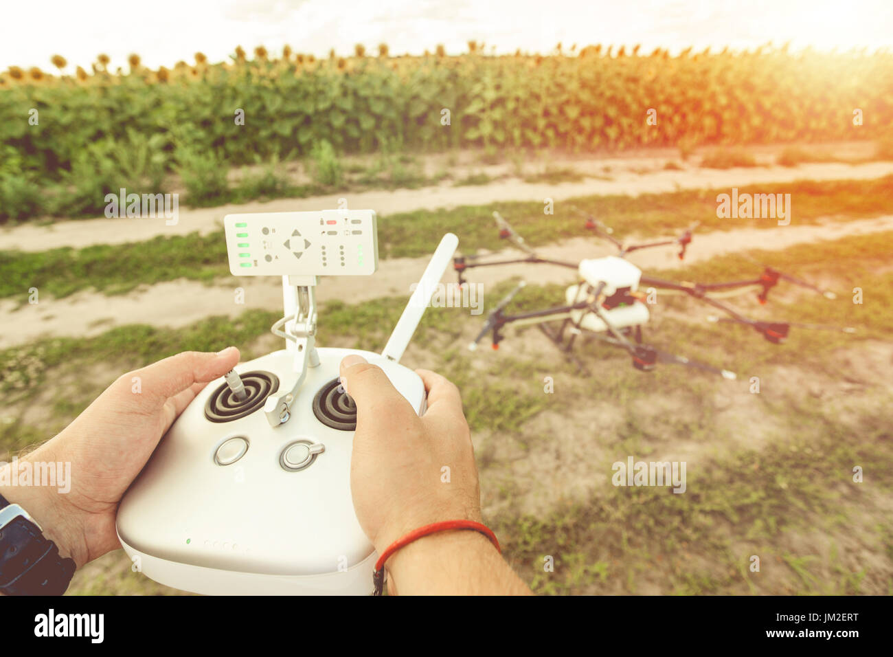 Person using remote control hi-res stock photography and images - Alamy