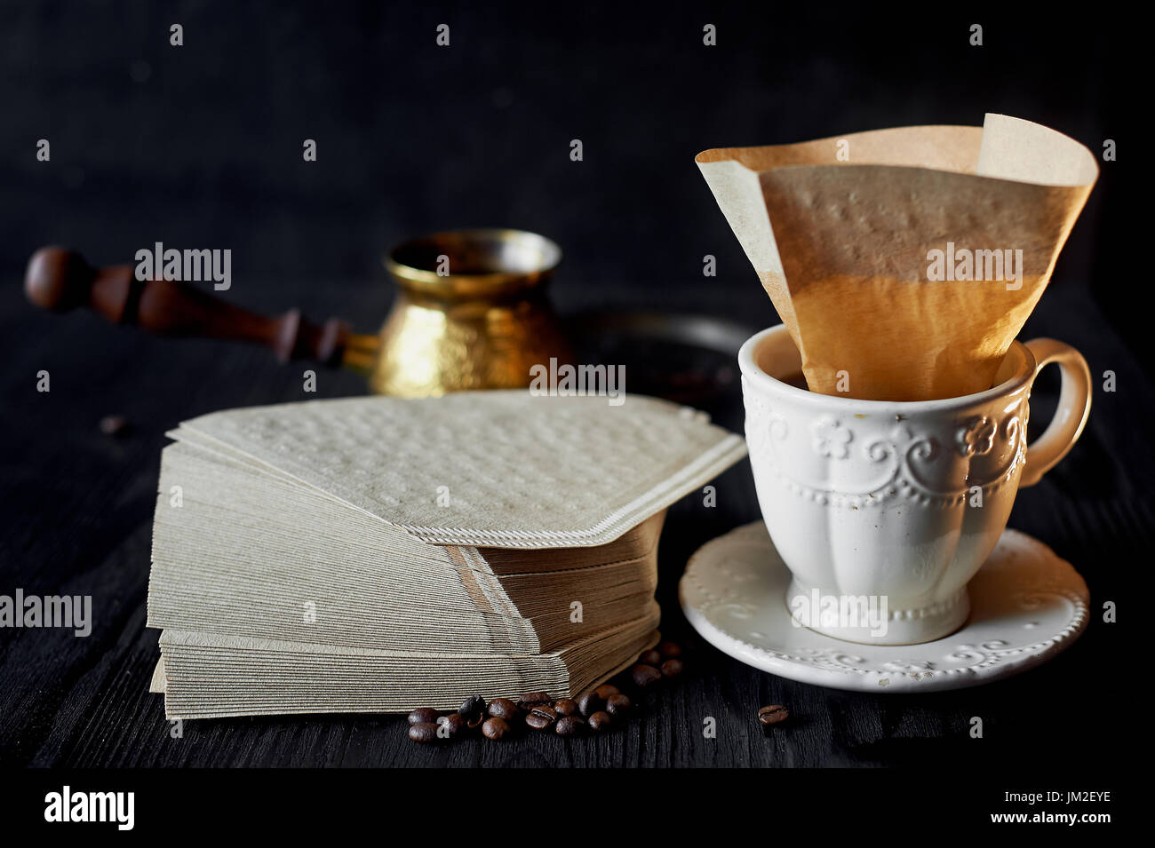 A stack of coffee filters from Kraft paper, and white Cup . Macro Stock ...