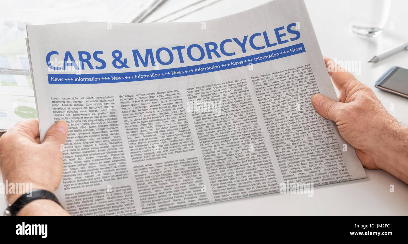 Man reading newspaper with the headline Cars and Motorcycles Stock ...