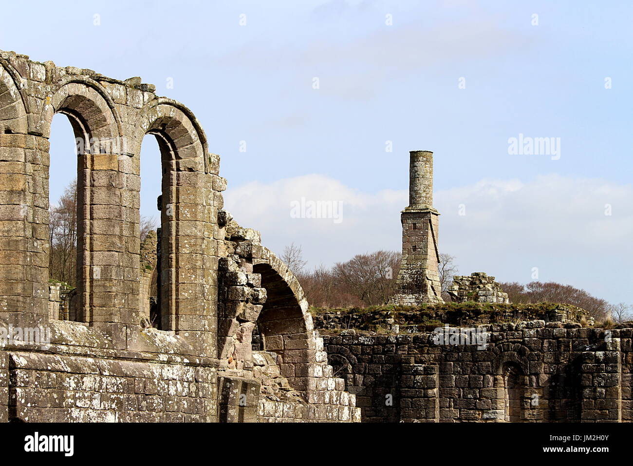 Grand stone arch windows and chimney of Fountains Abbey, Yorkshire ...