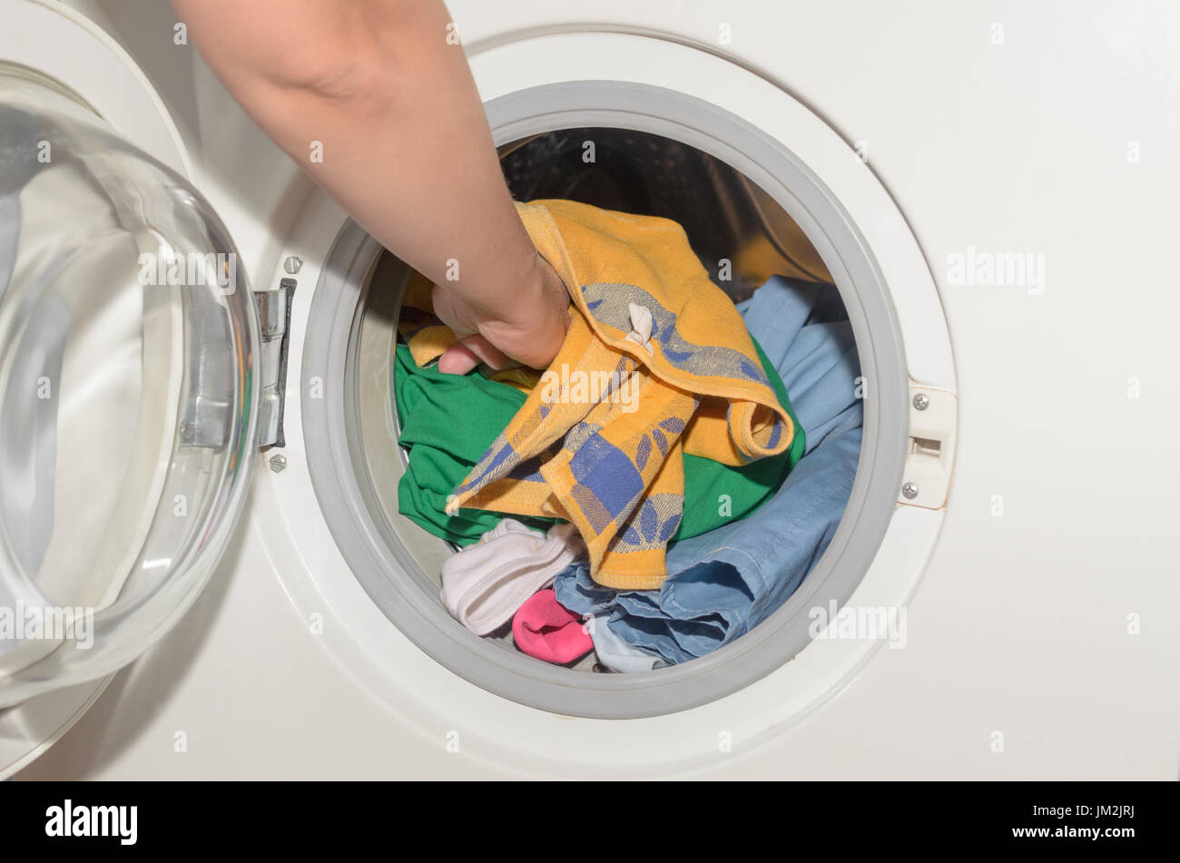 Washing dirty clothes in an automatic washing machine Stock Photo - Alamy