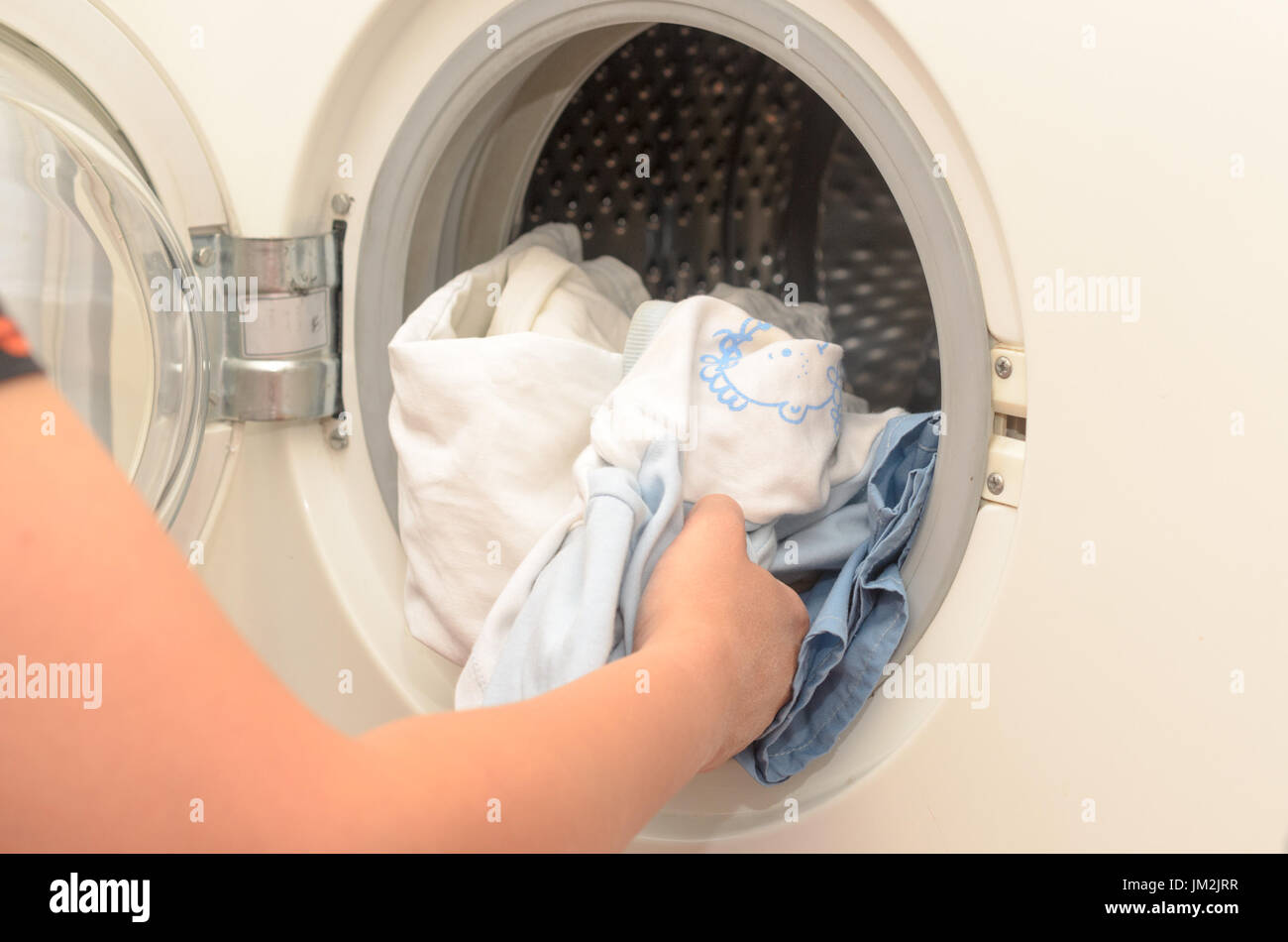 Washing dirty clothes in an automatic washing machine Stock Photo - Alamy