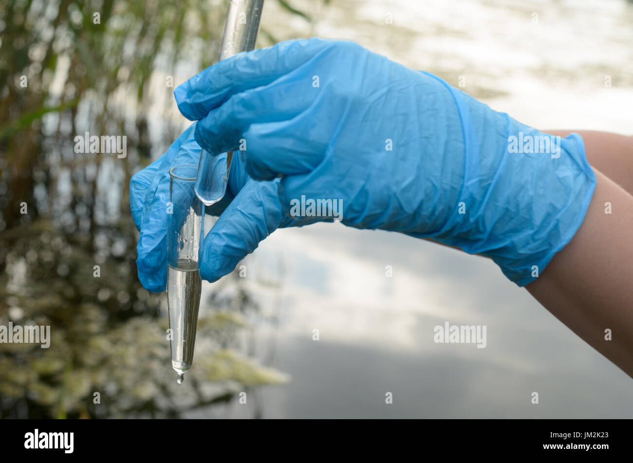 Taking a water test for analysis from a reservoir Stock Photo - Alamy