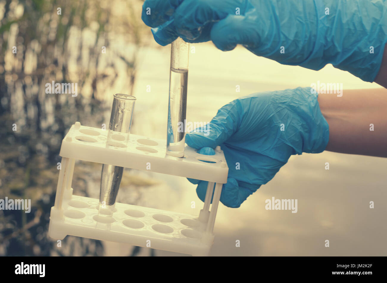Taking a water test for analysis from a reservoir Stock Photo - Alamy