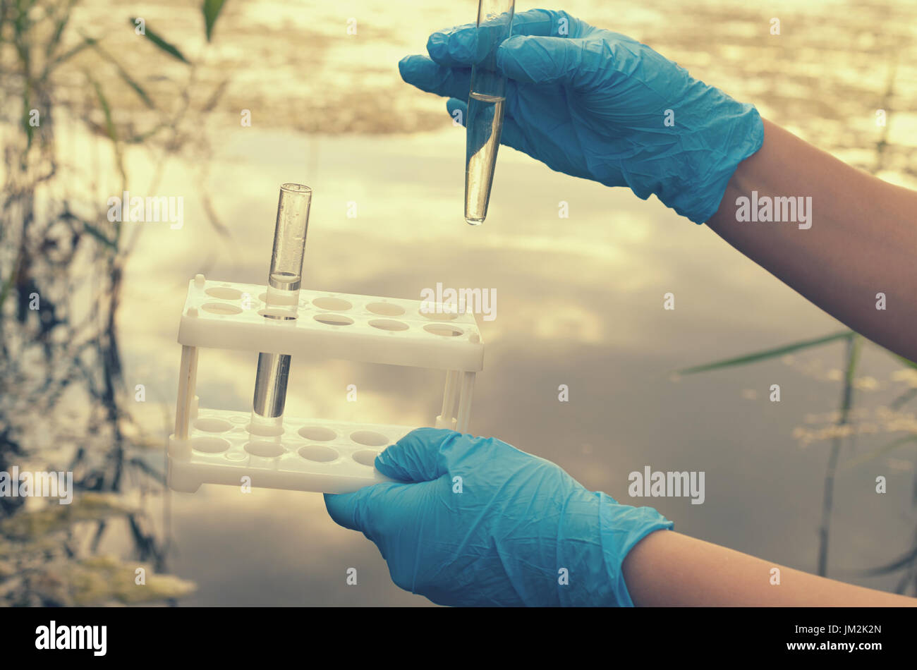 Taking a water test for analysis from a reservoir Stock Photo - Alamy
