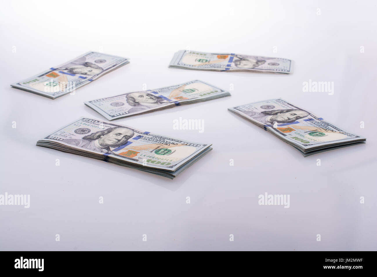 American 100 dollar banknote bundles placed on white background Stock ...