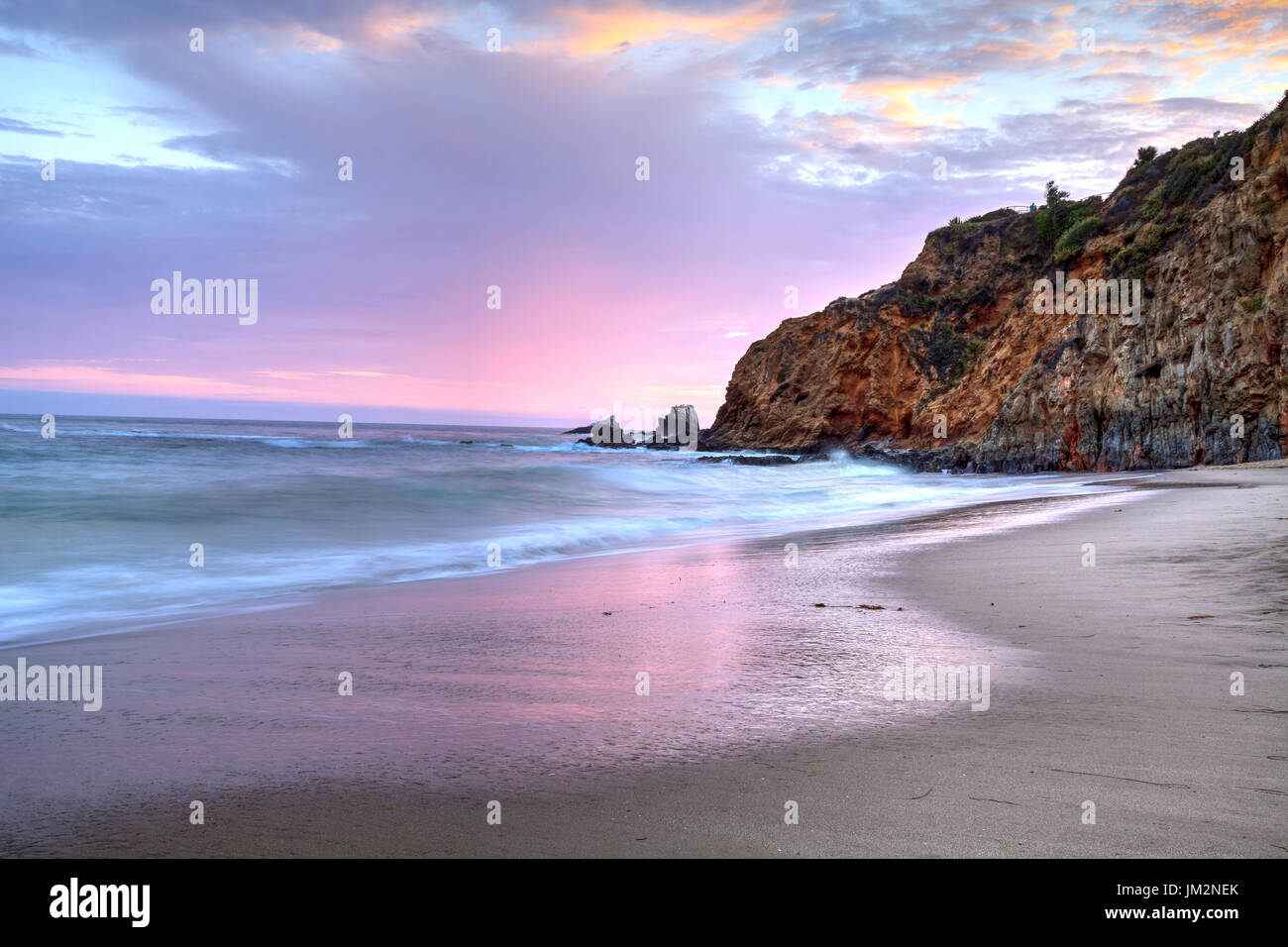 Sunset over the beach at Crescent Bay in Laguna Beach, California, USA ...