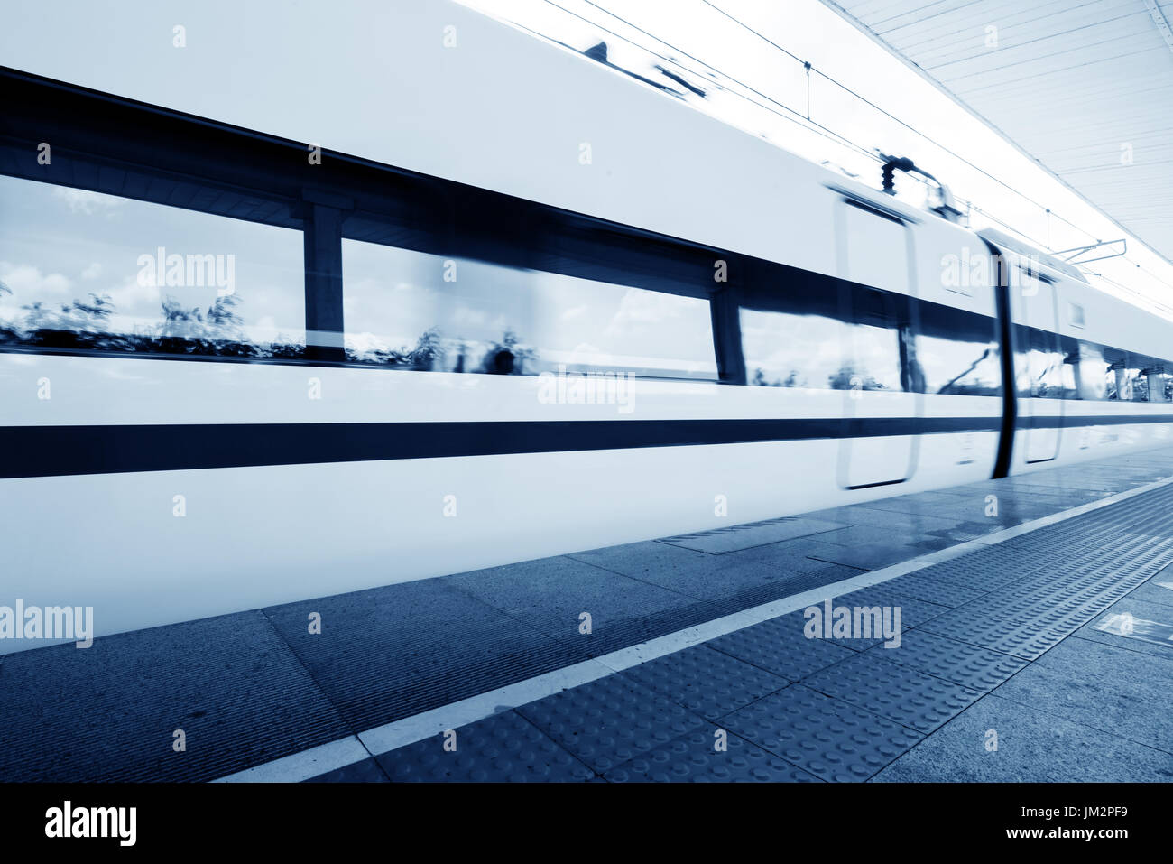 Dynamic blurred high-speed train, blue tone map Stock Photo - Alamy