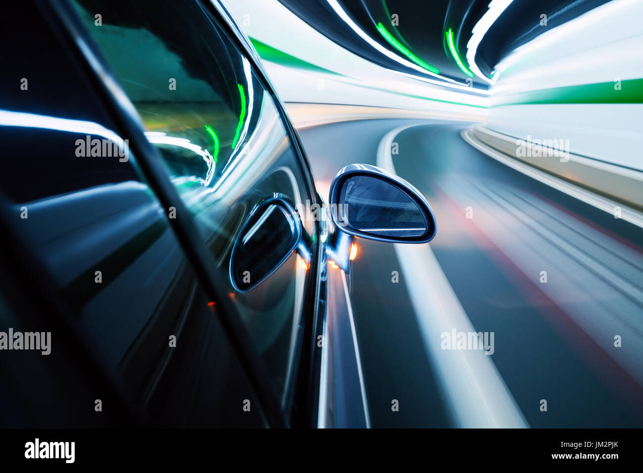 A car driving on a motorway at high speeds, overtaking other cars Stock ...