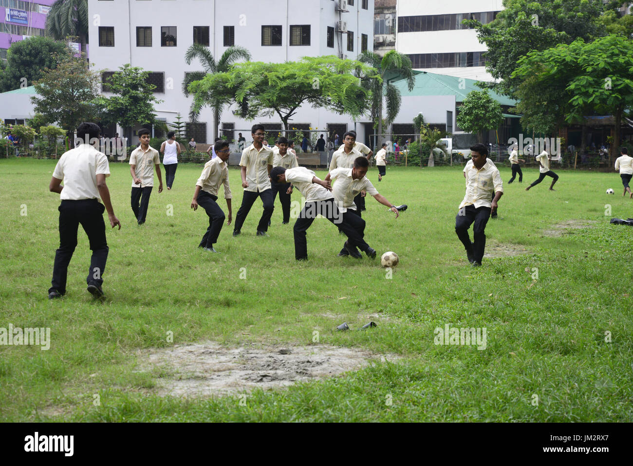Bangladeshi collage students playing football on the collage ground at ...