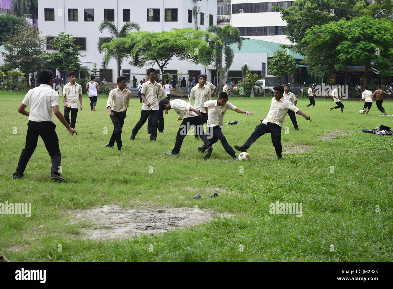 Bangladeshi collage students playing football on the collage ground at ...
