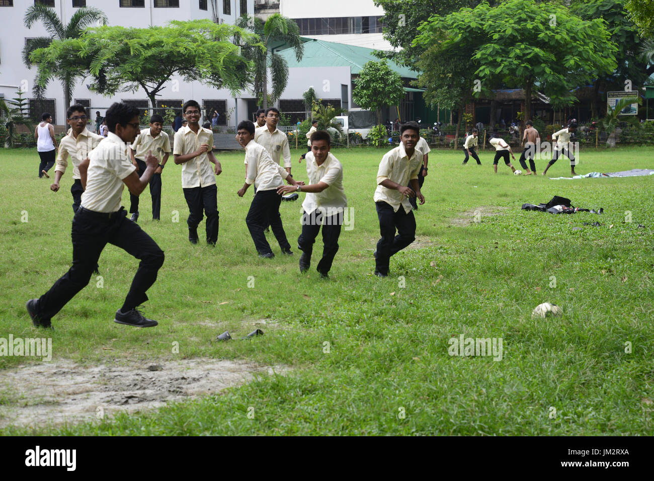 Bangladeshi collage students playing football on the collage ground at ...
