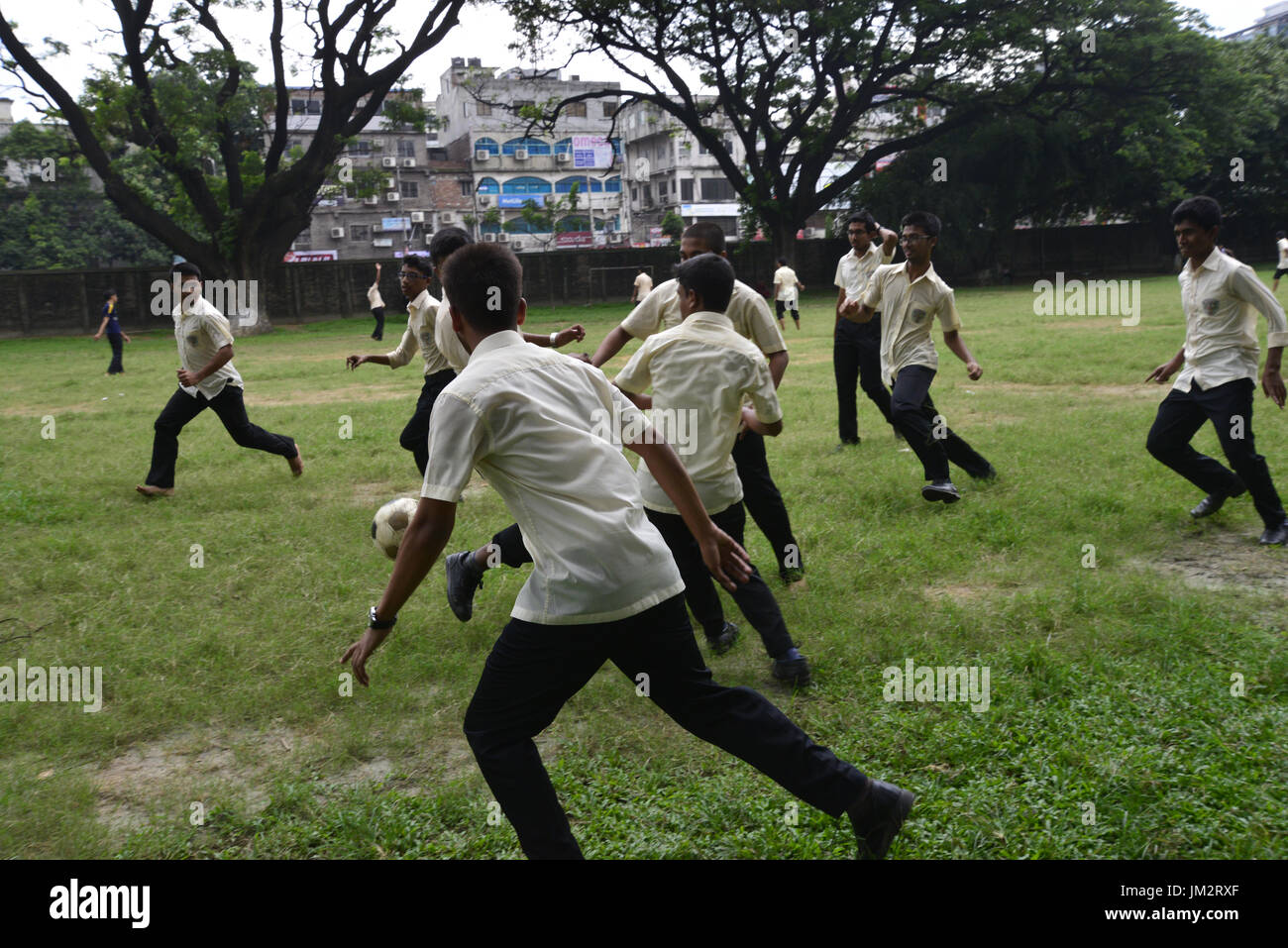 Bangladeshi collage students playing football on the collage ground at ...