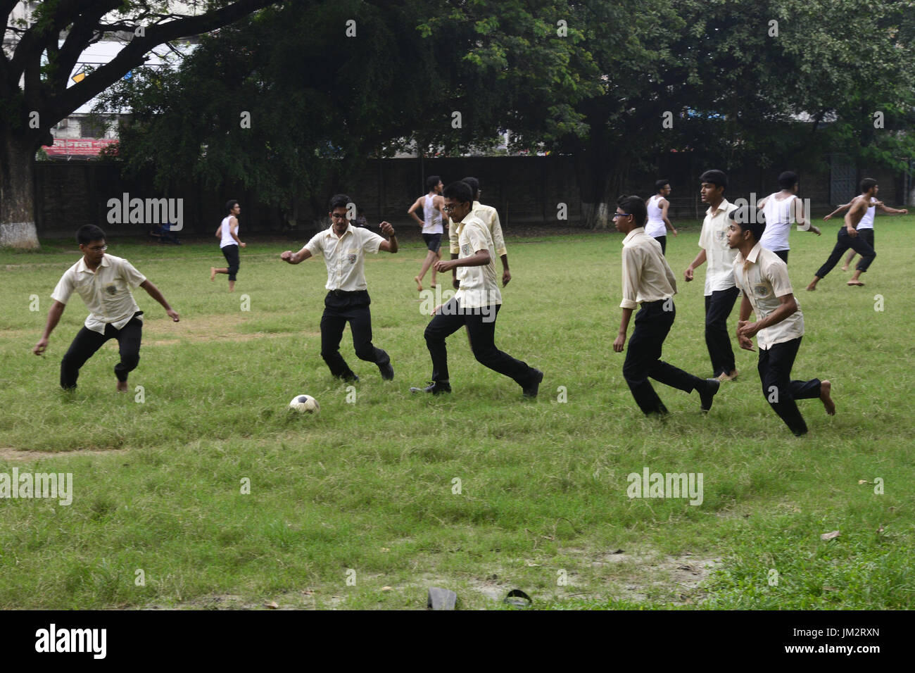 Bangladeshi collage students playing football on the collage ground at ...