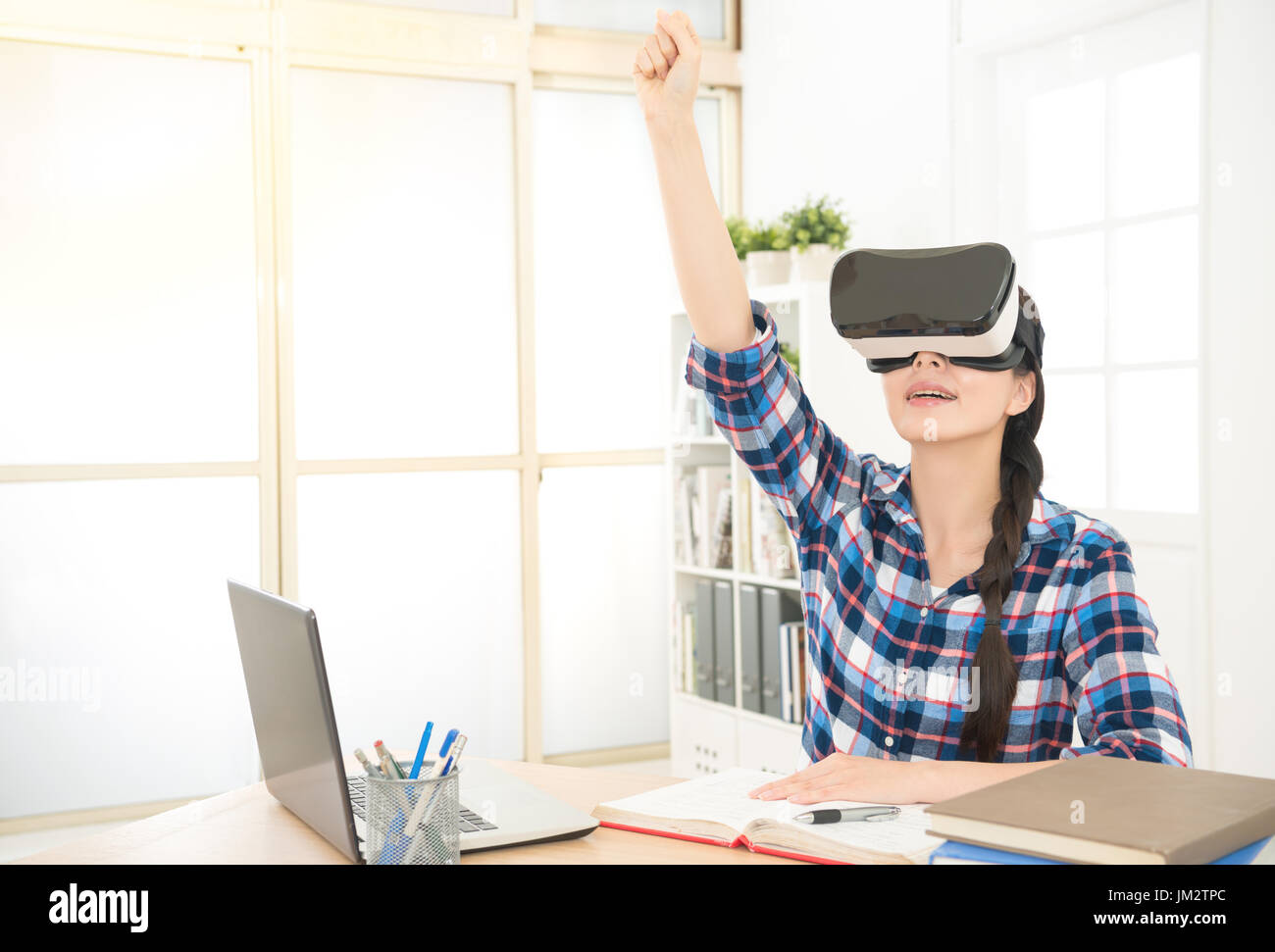 student using computer connect e-learning with VR-headset device ...
