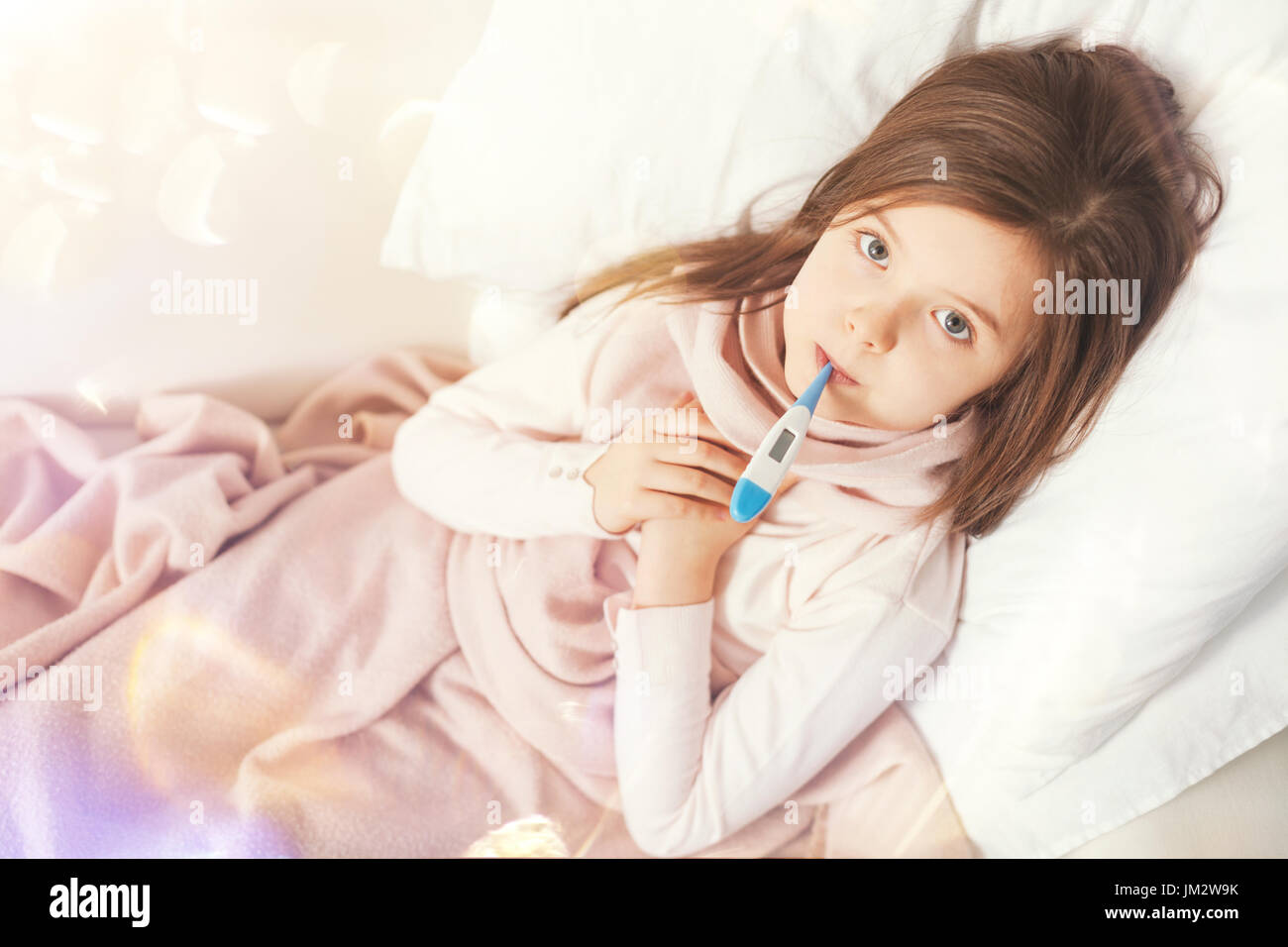 Sick kid looking straight at camera Stock Photo - Alamy