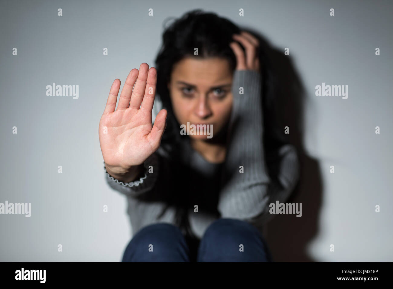 unhappy crying woman showing defensive gesture Stock Photo - Alamy