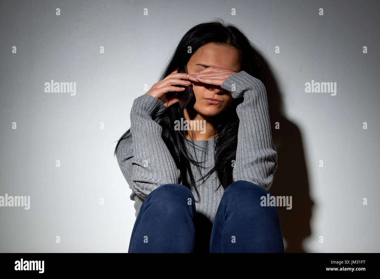 Woman calling helpline hi-res stock photography and images - Alamy