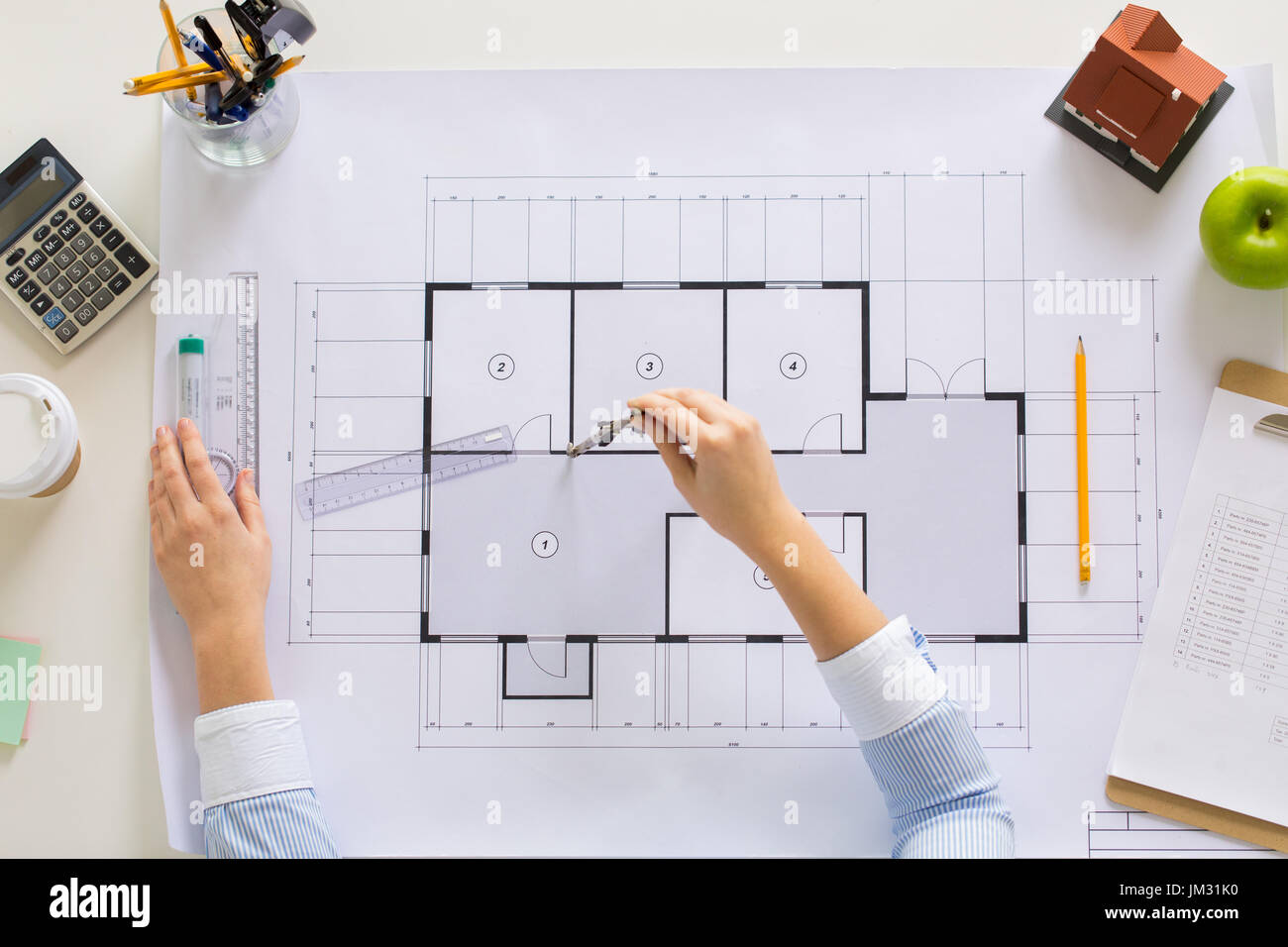 hands with compass measuring blueprint at office Stock Photo - Alamy