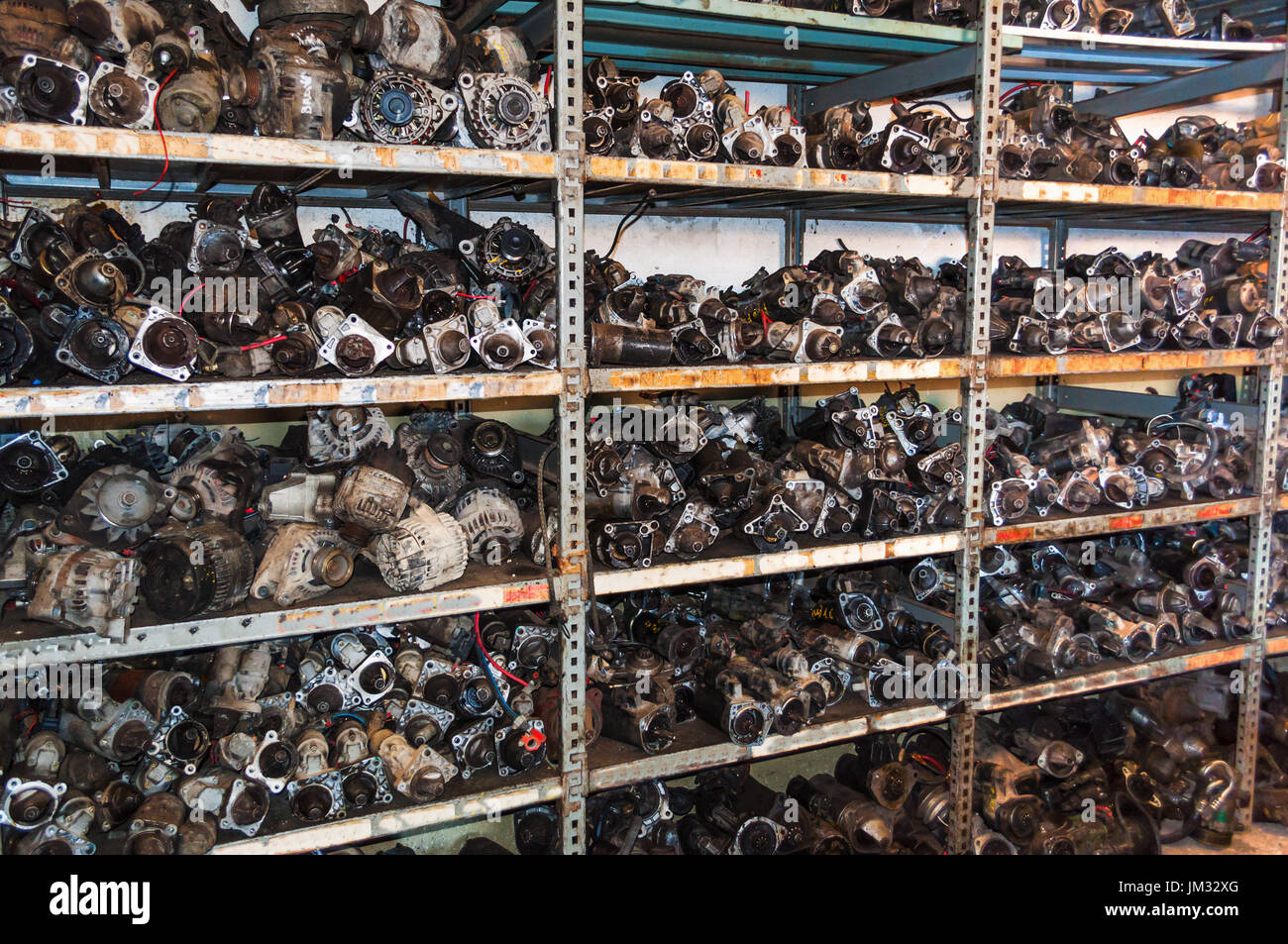 shelf full of used engine parts Stock Photo - Alamy