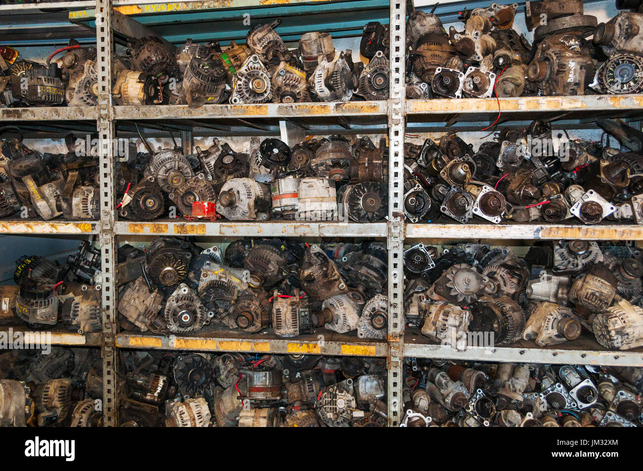 shelf full of used engine parts Stock Photo - Alamy