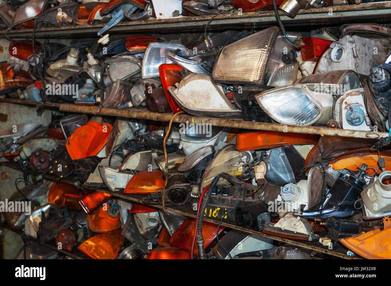 shelf full of used engine parts Stock Photo - Alamy