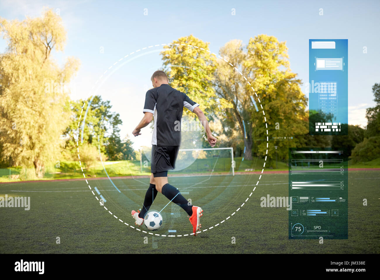 soccer player playing with ball on football field Stock Photo - Alamy
