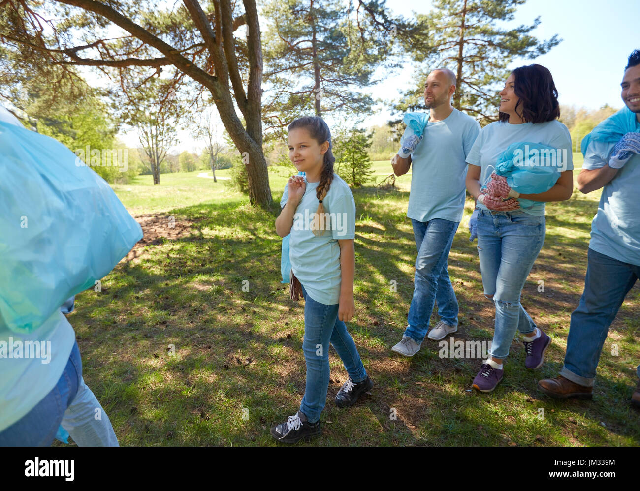 volunteers with garbage bags walking outdoors Stock Photo - Alamy