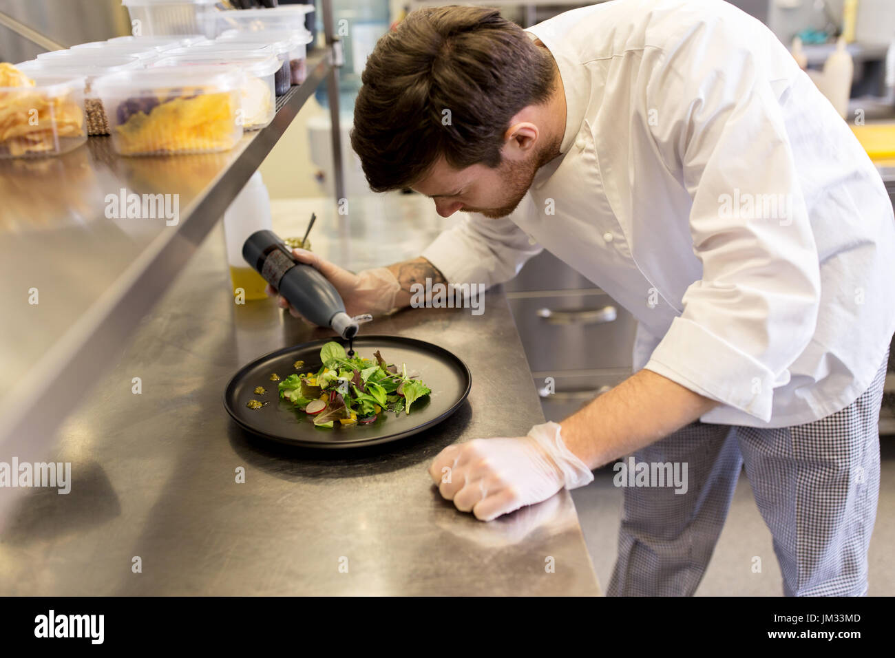 male chef cooking food at restaurant kitchen Stock Photo - Alamy
