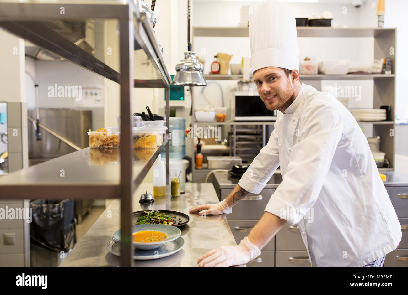 happy male chef cooking food at restaurant kitchen Stock Photo - Alamy
