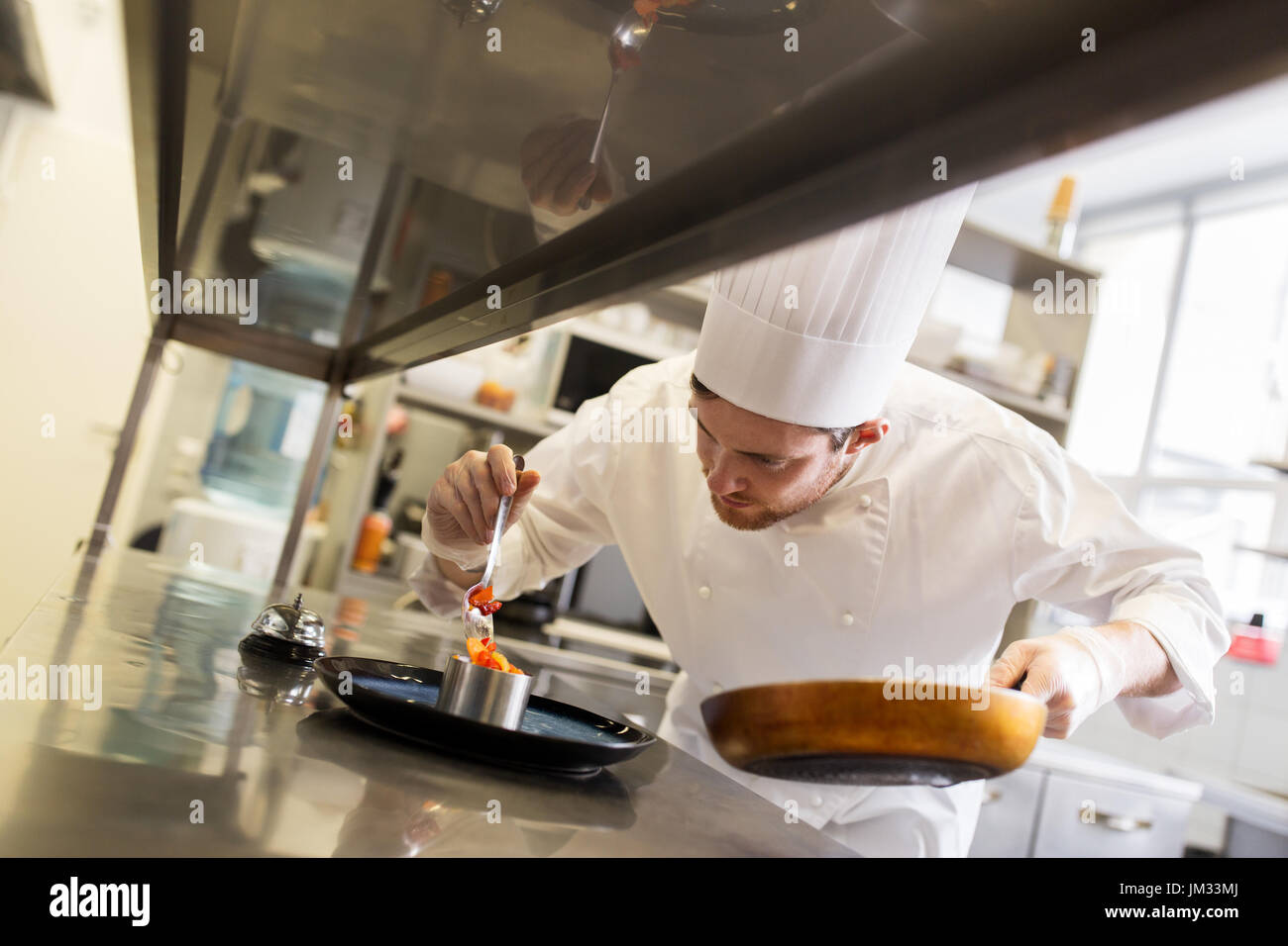 happy male chef cooking food at restaurant kitchen Stock Photo - Alamy