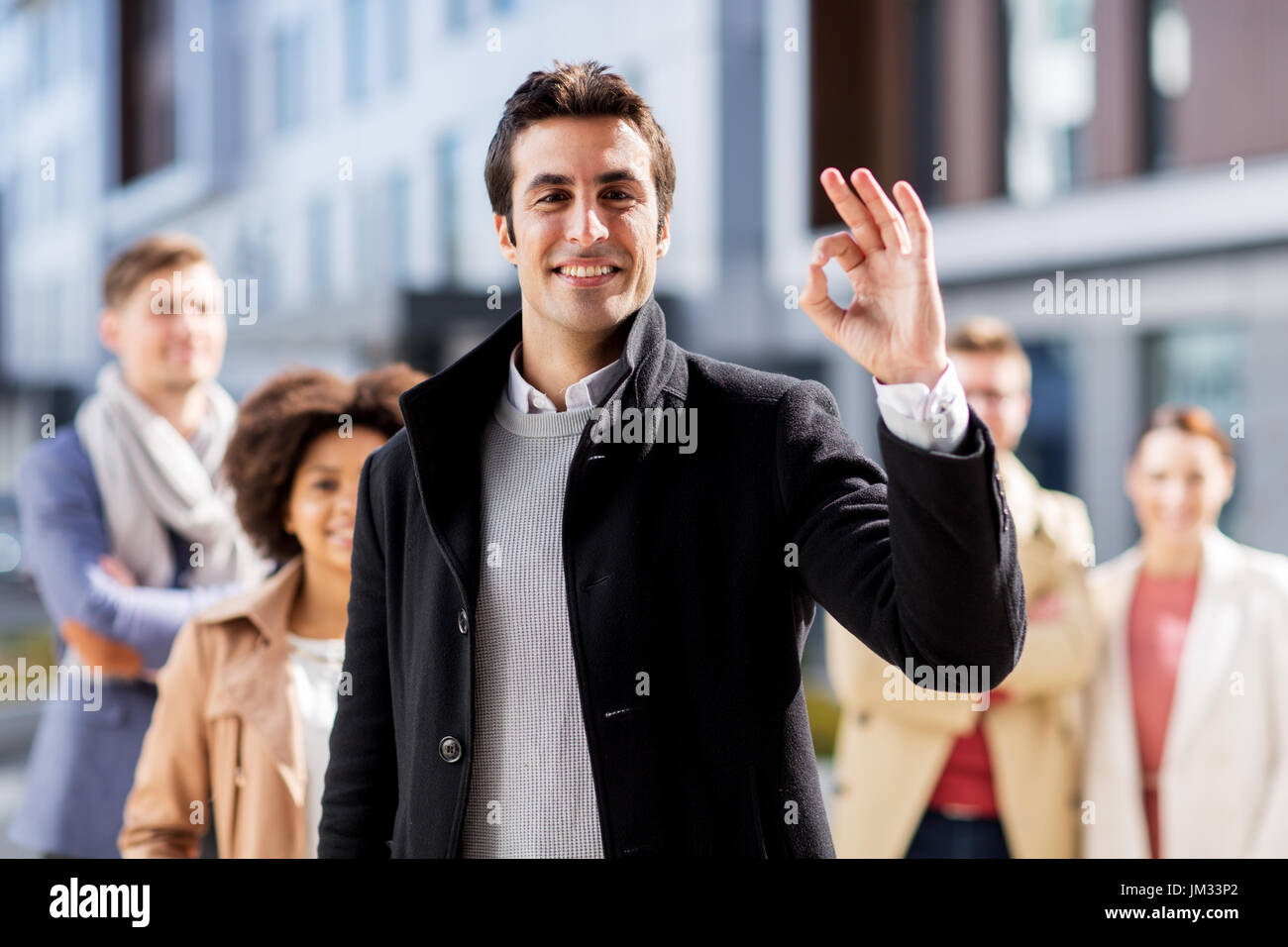 international business team showing ok hand sign Stock Photo - Alamy