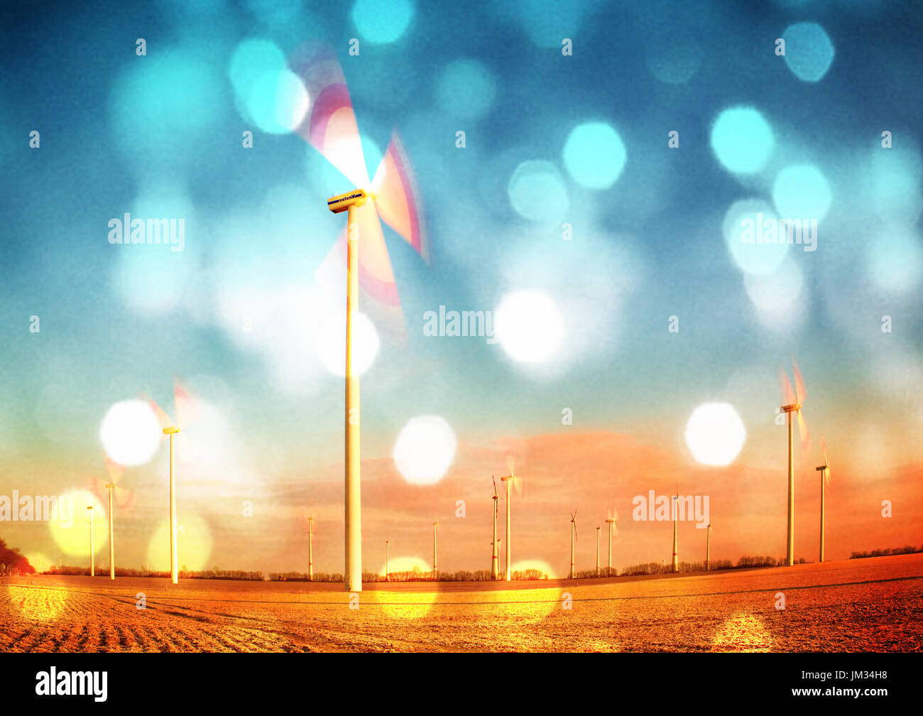 Film grain effect. Modern Wind Turbines Producing Energy in suny spring ...