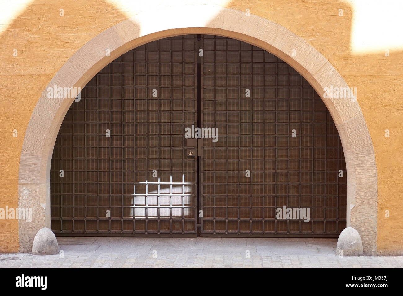 Old forged metal double gates for entry of people orcars into the yard ...