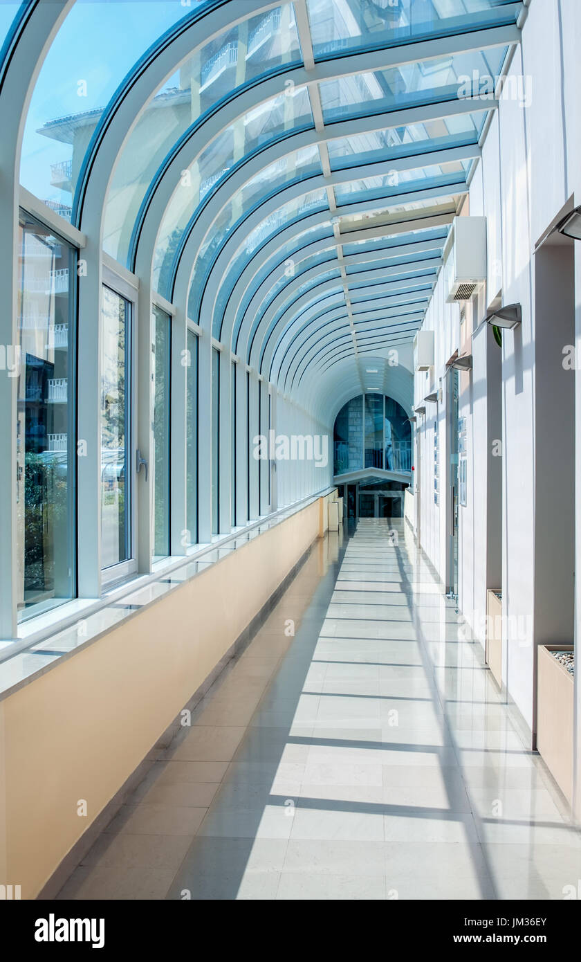 The corridor in the form of a semicircular tunnel with transparent ...