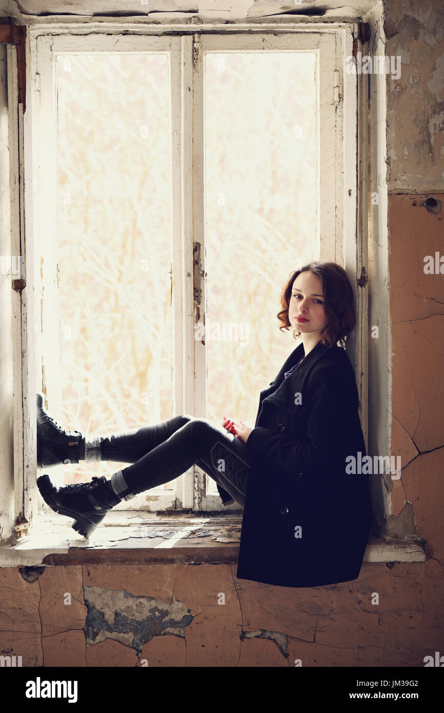 girl sitting on the window Stock Photo - Alamy