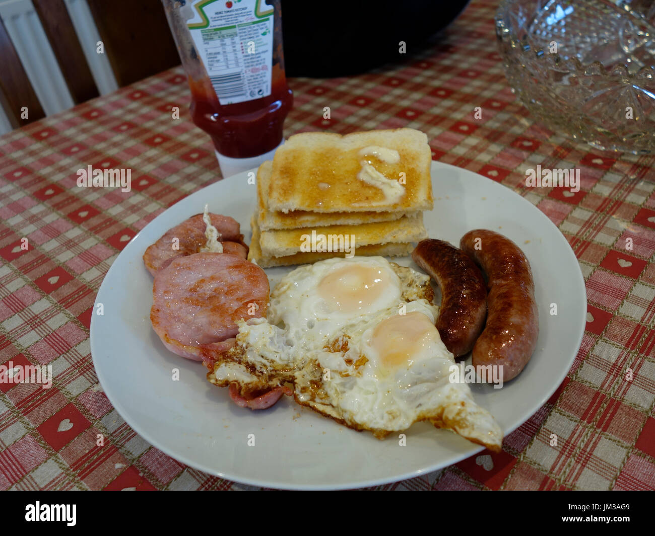 English breakfast eggs, toast, bacon and sausage Stock Photo - Alamy