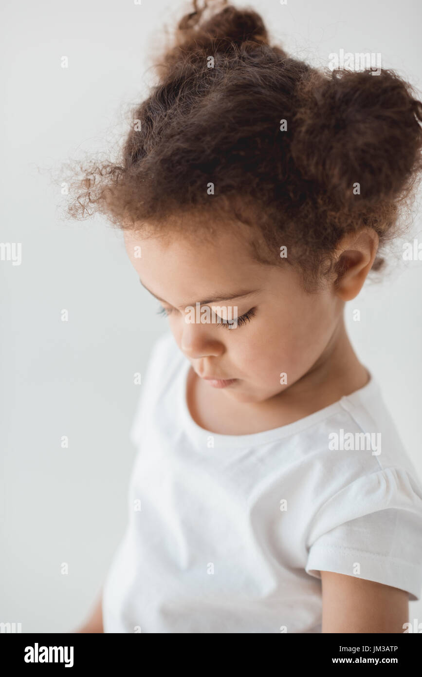 adorable little kid girl looking down isolated on white Stock Photo - Alamy