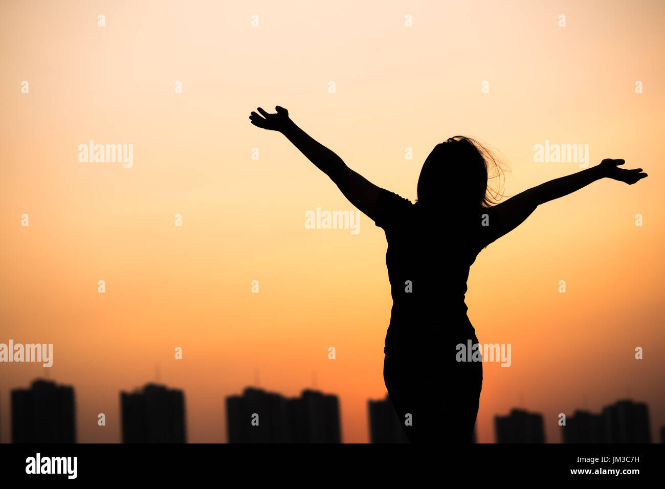 Silhouette Success Woman Hands Up With Sunset Sky Background Stock