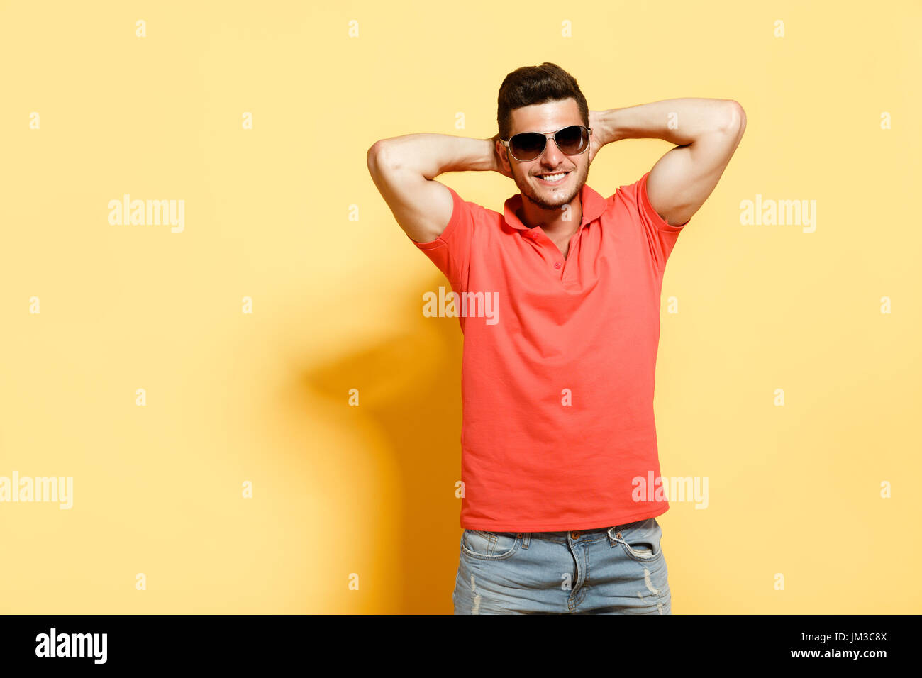 Male model arms behind head hi-res stock photography and images - Alamy
