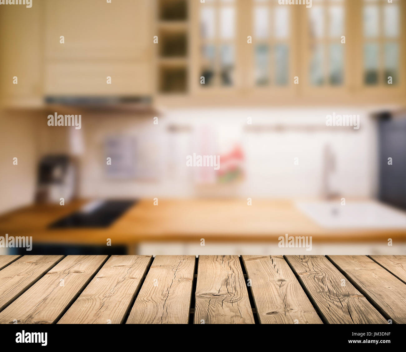 wooden counter top with kitchen blurred background Stock Photo - Alamy