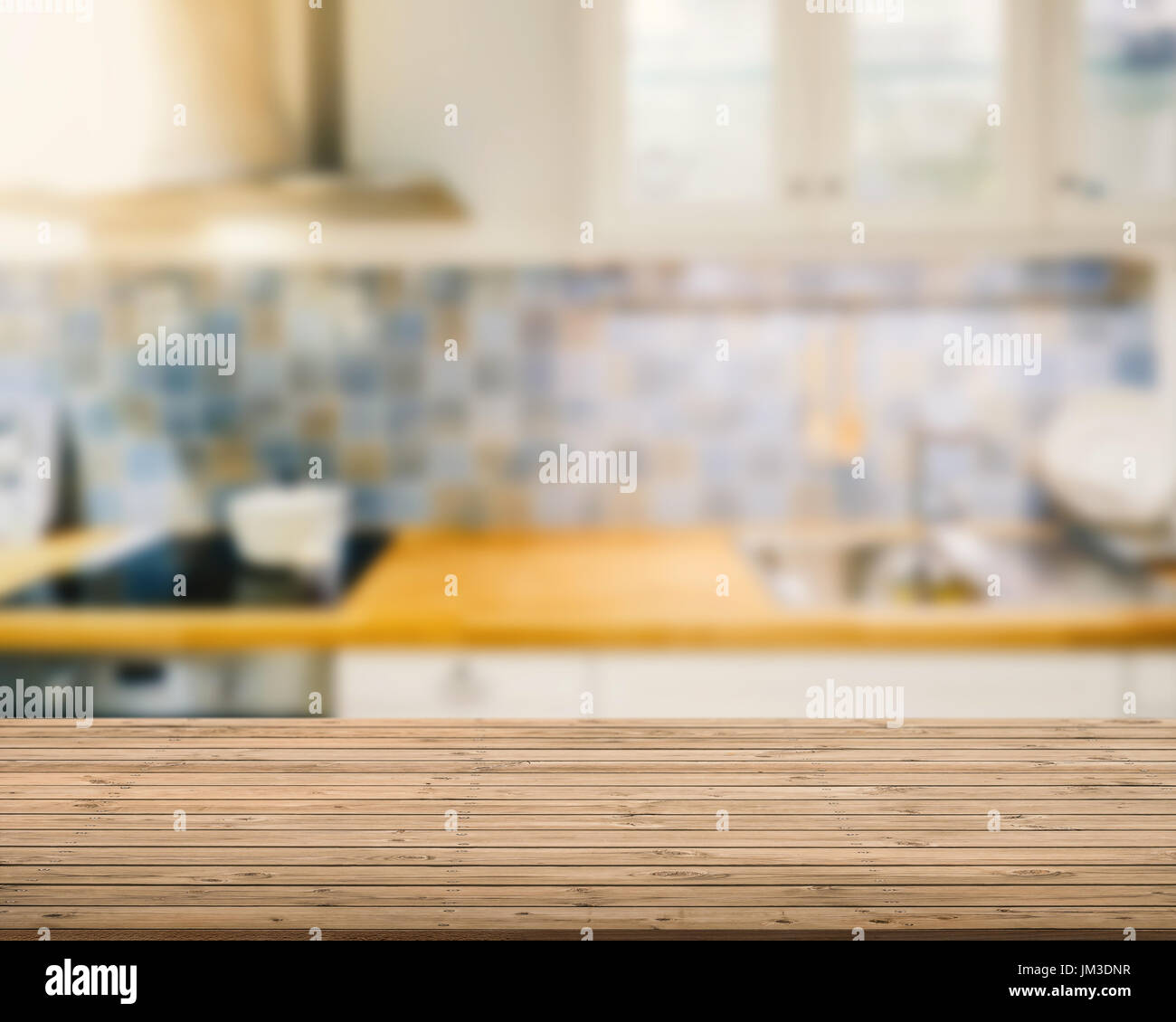 wooden counter top with kitchen blurred background Stock Photo - Alamy