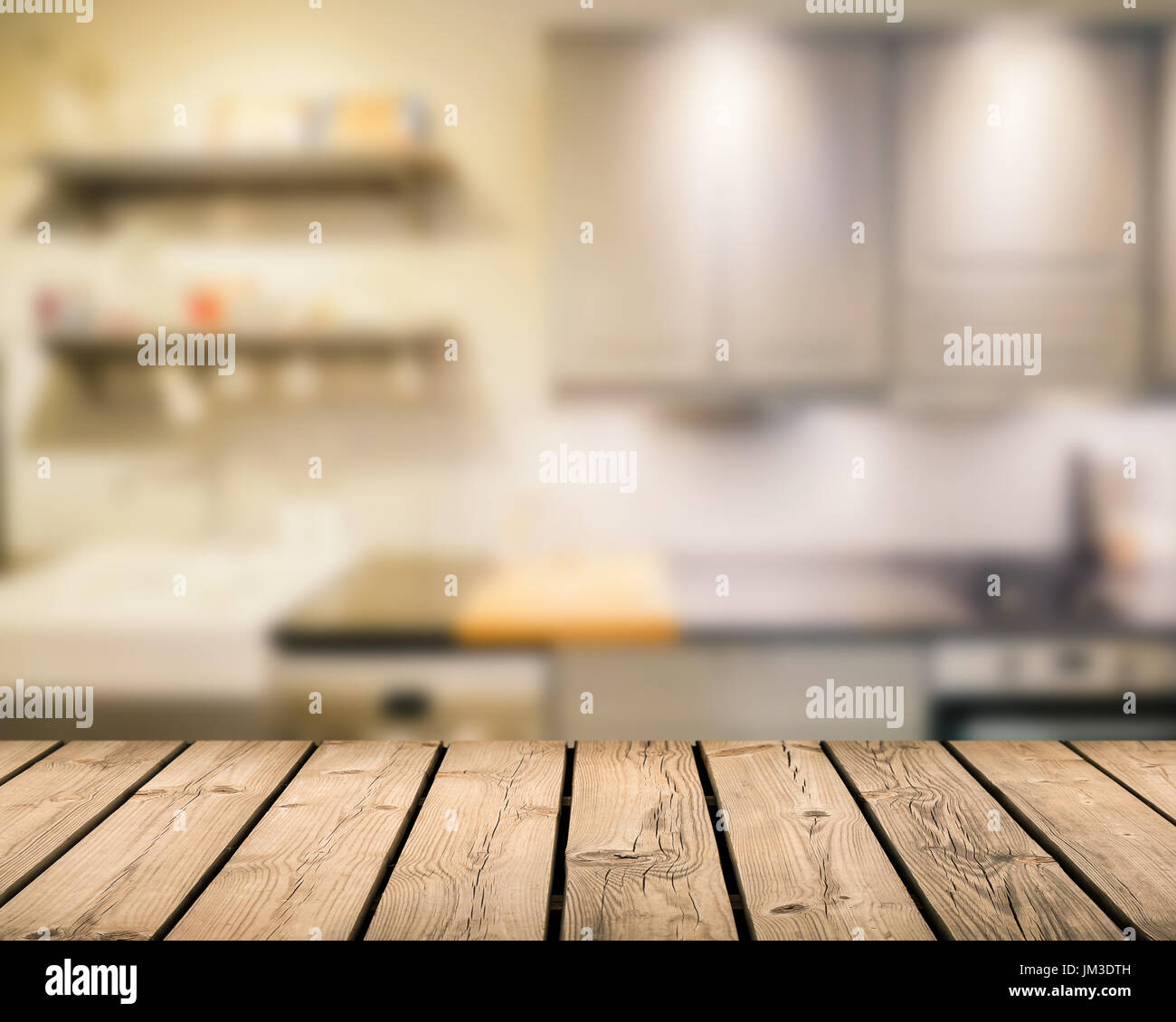 wooden counter top with kitchen blurred background Stock Photo - Alamy