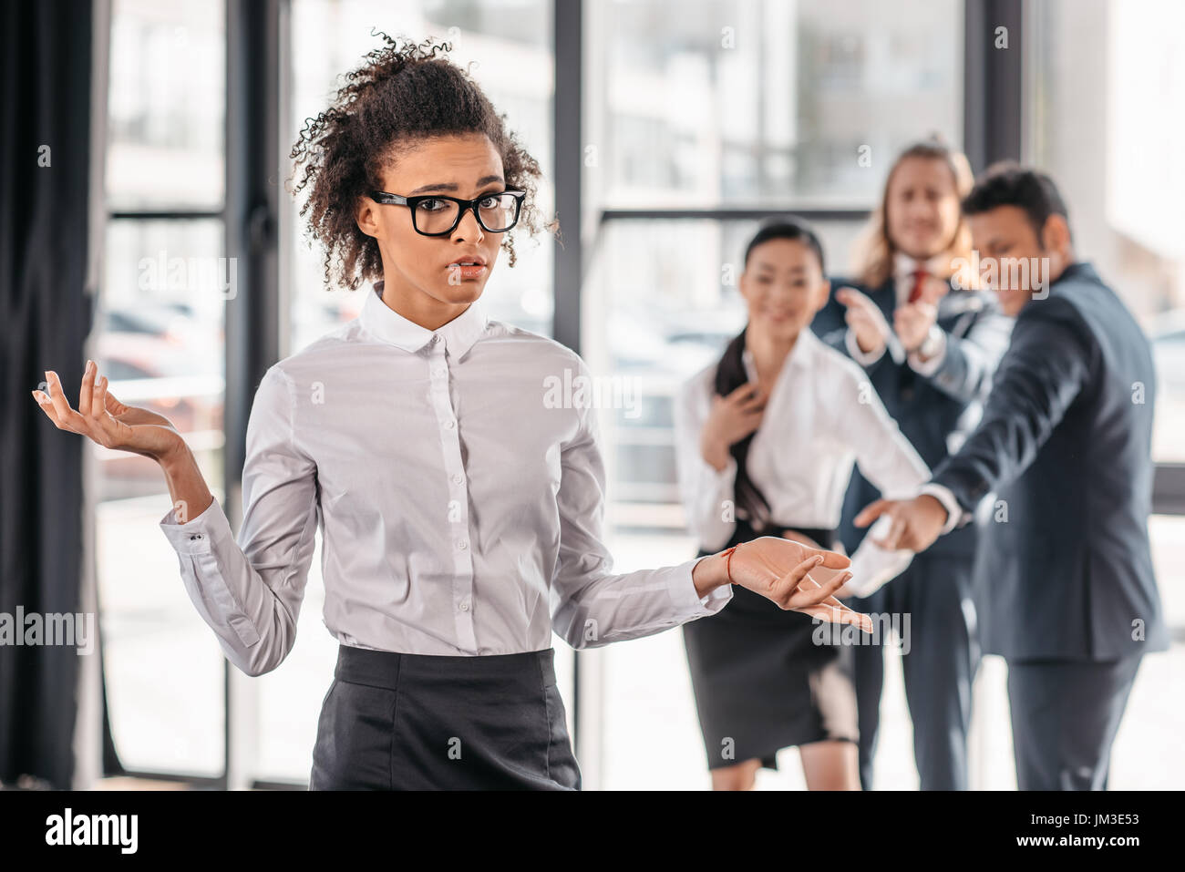african american businesswoman with shrug gesture, businesspeople ...